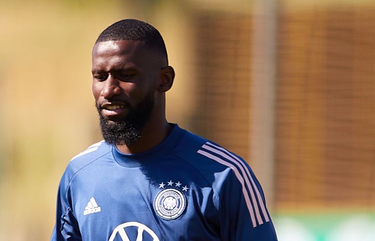 Rudiger poses with Real Madrid shirt after completing move